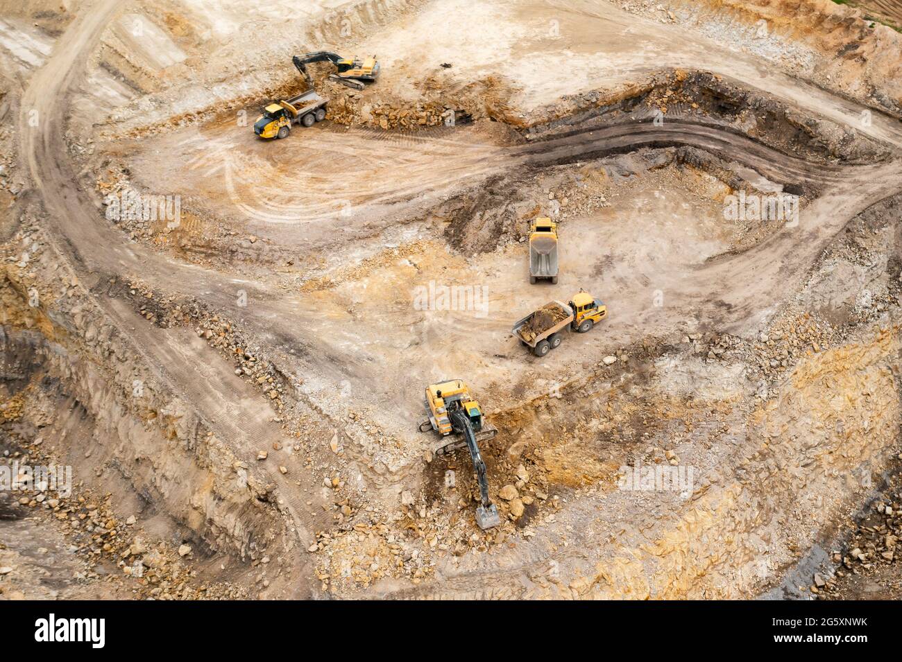 Aerial view of excavators digging ground. Opencast mining quarry Stock ...