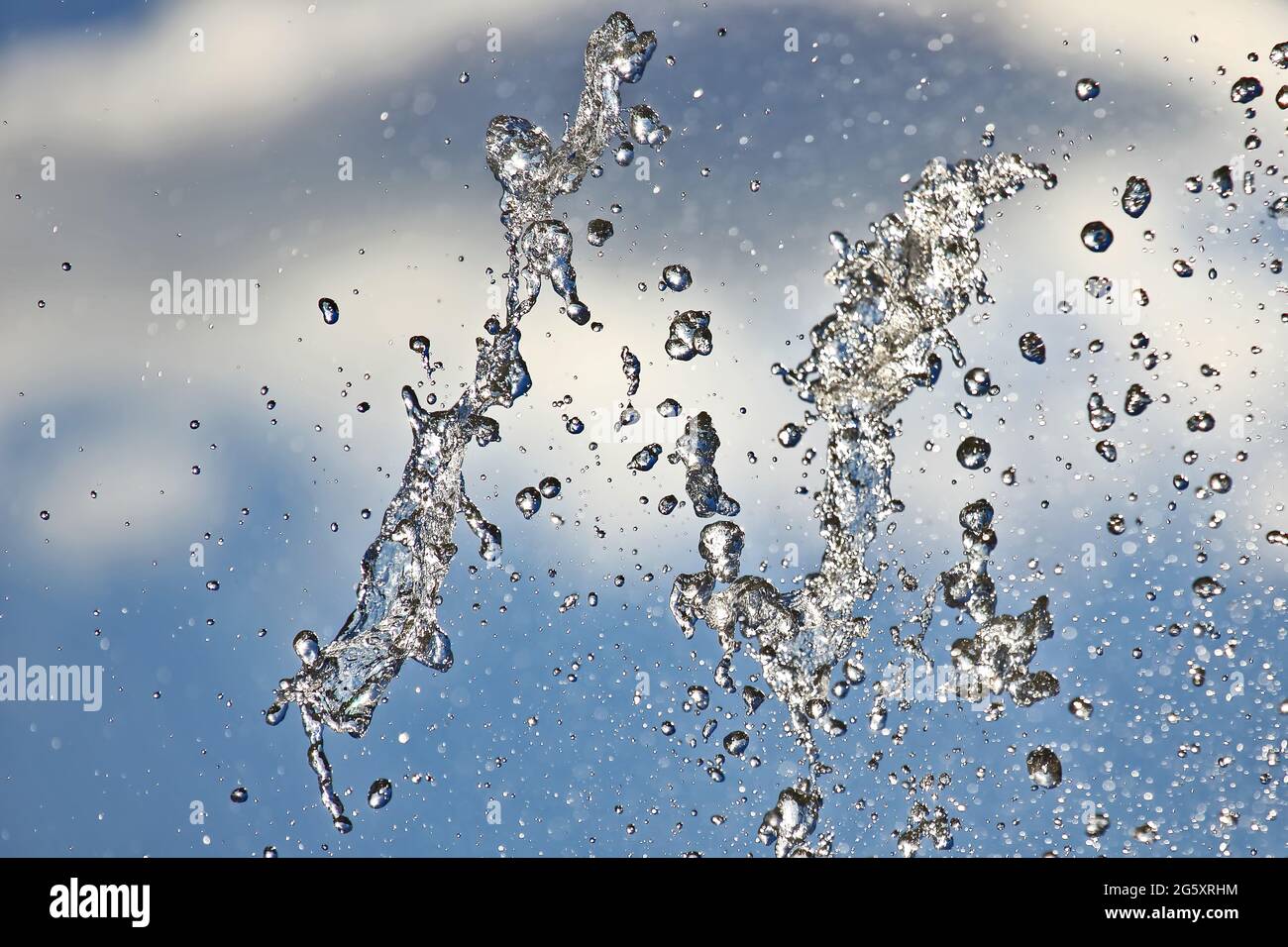 Splashes of flying water from the fountain Stock Photo - Alamy