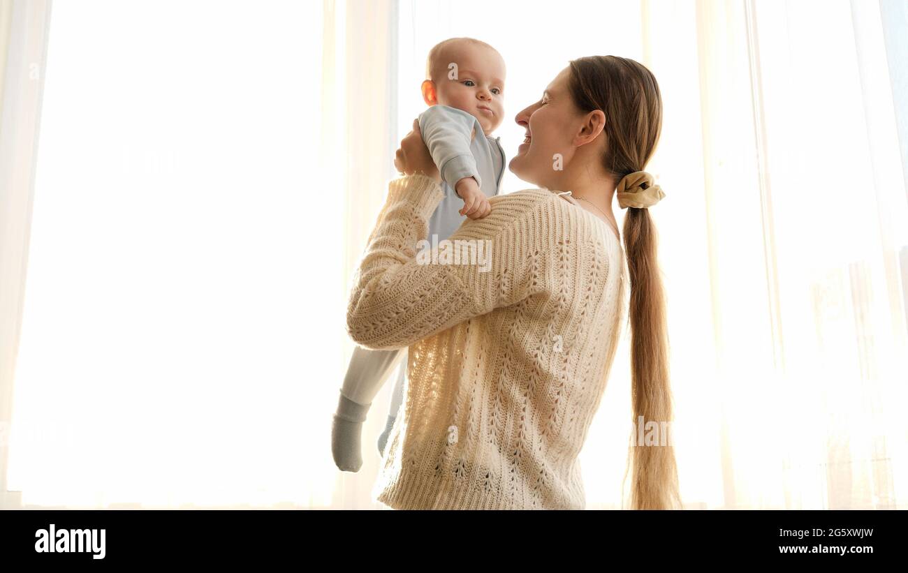 Mother baby lifting silhouette hi-res stock photography and images - Alamy