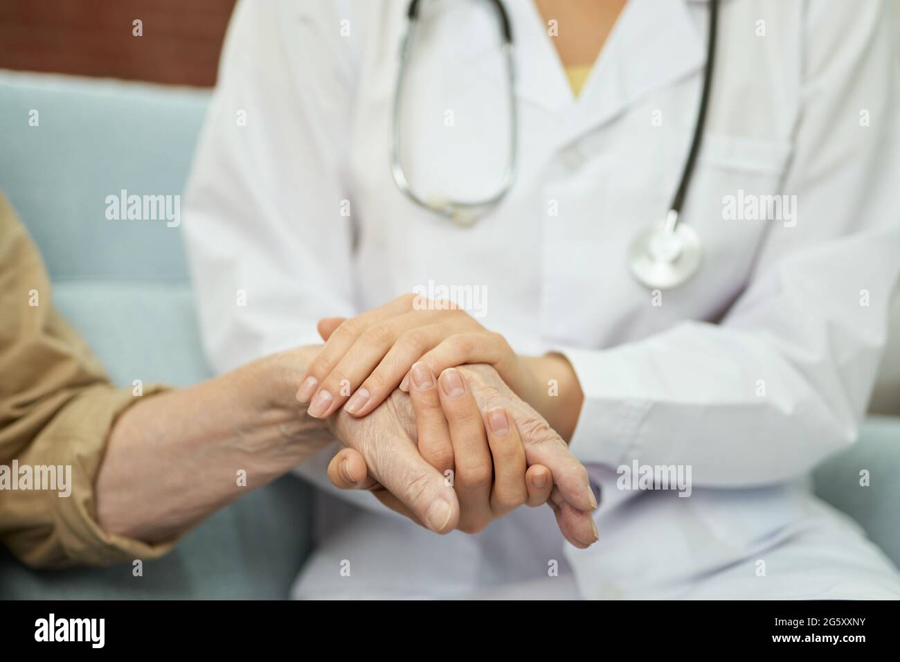 Caring nurse supporting the male patient during treatment Stock Photo ...