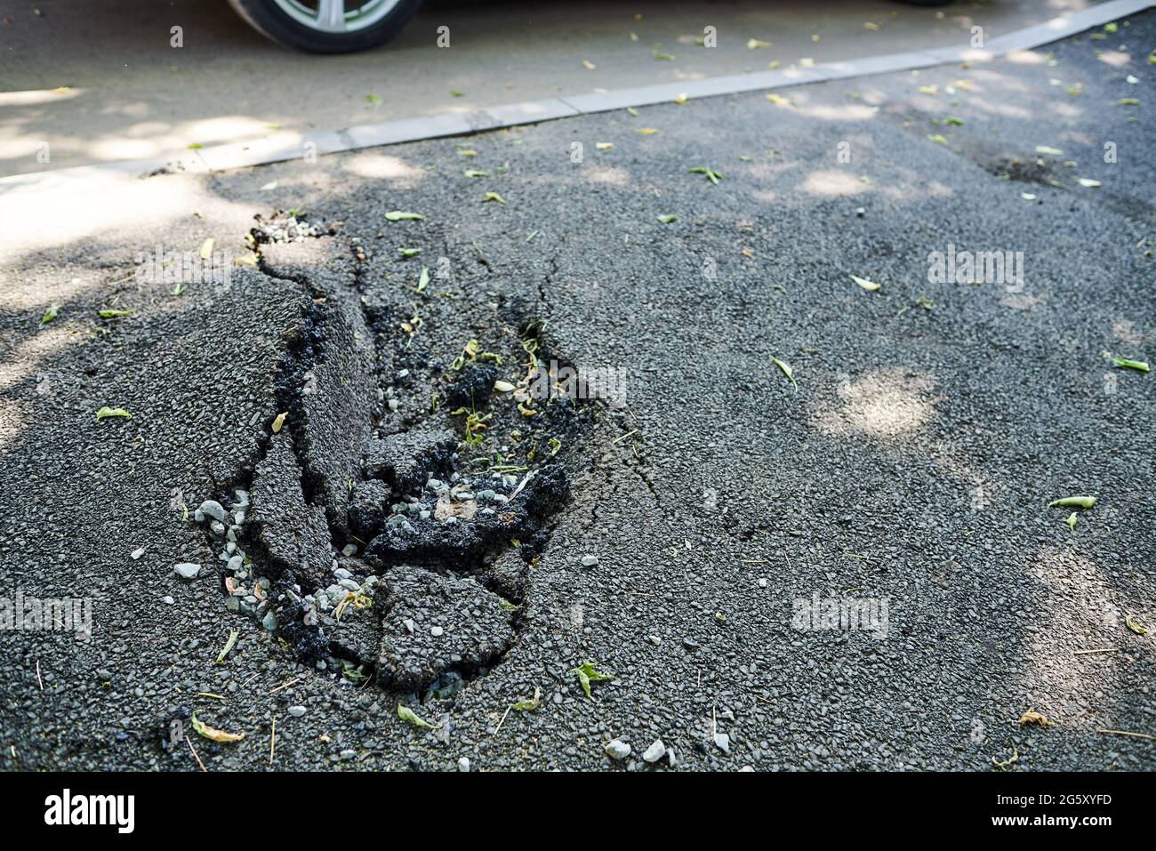 New, but already swollen and cracked asphalt Stock Photo - Alamy
