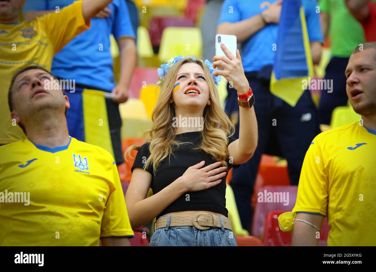 BUCHAREST, ROMANIA - JUNE 21, 2021: Ukrainian football fan sings ...
