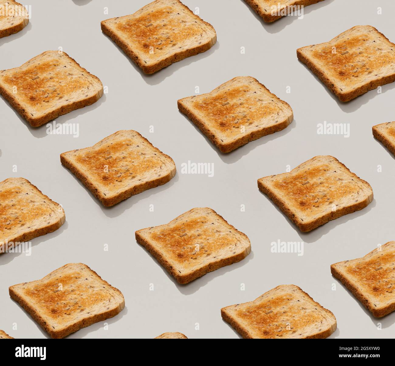 Pattern with fresh toasted bread on gray background flat lay top view ...
