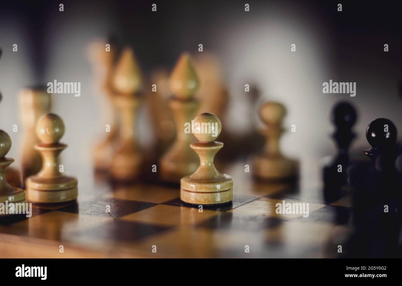 Wooden chess pieces on the chessboard. Intellectual game -chess. Chess ...