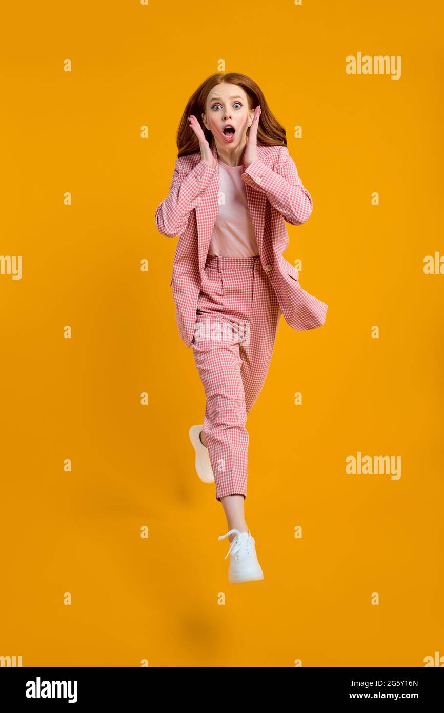 Full size photo of young happy shocked amazed surprised woman jumping ...