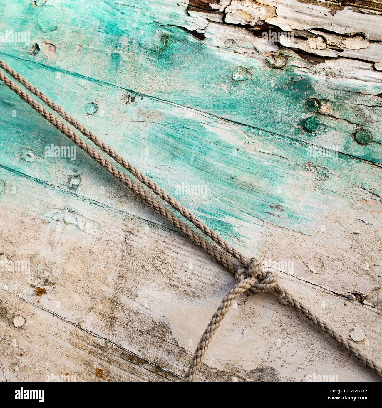 Old and colored boat wooden hull, old painting with green and white ...