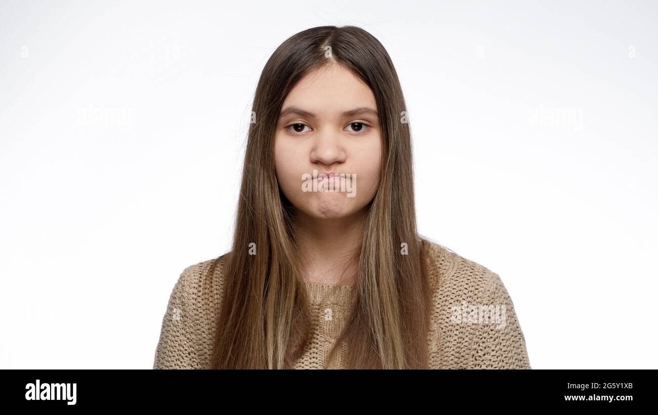 Portrait of angry and nervous girl calming down and breathing deeply ...