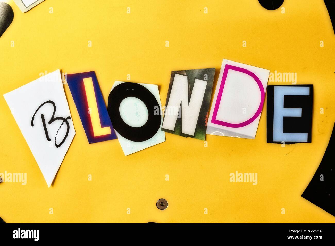 The word "Blonde" using cut-out paper letters in the ransom note effect ...
