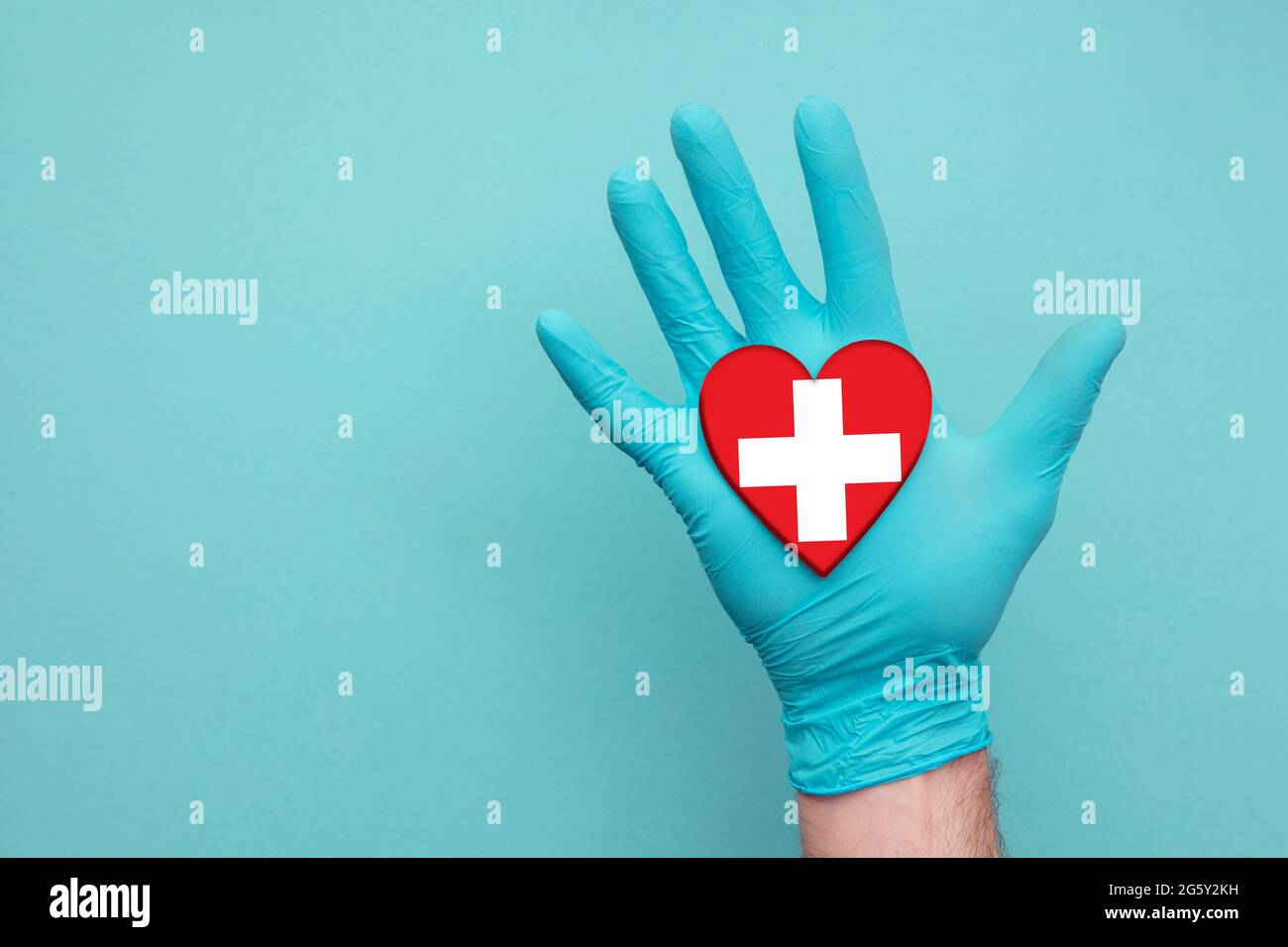 Switzerland medical health heart. Nurse hand holding country heart flag ...