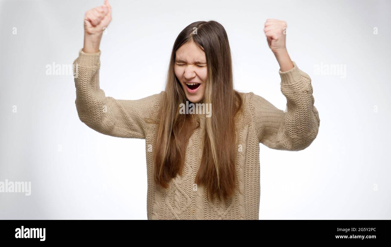 Happy dancing and cheering girl laughing and smile because of success ...