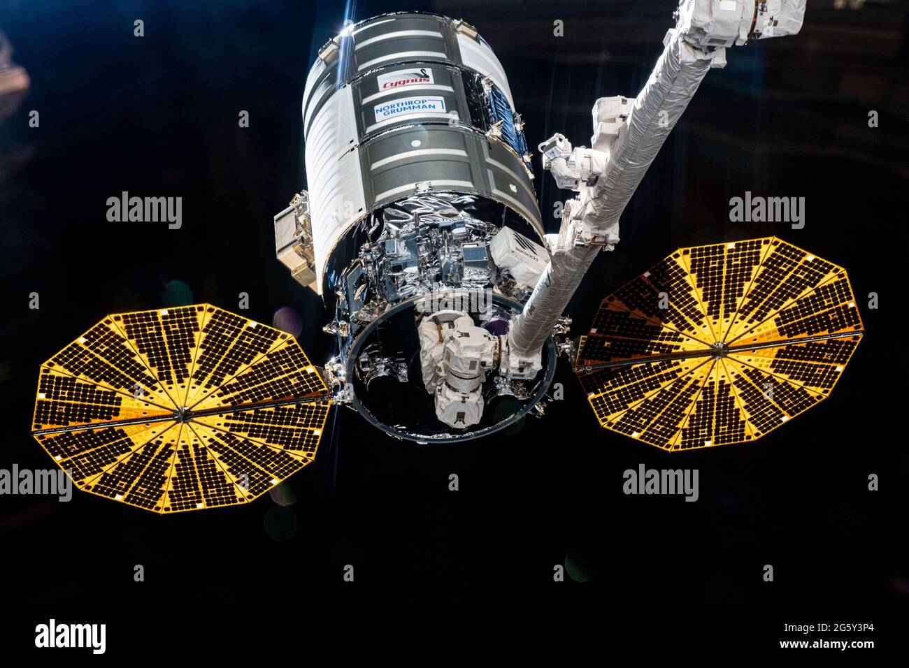 The Northrop Grumman Cygnus spacecraft is grappled by the CanadaArm2 ...