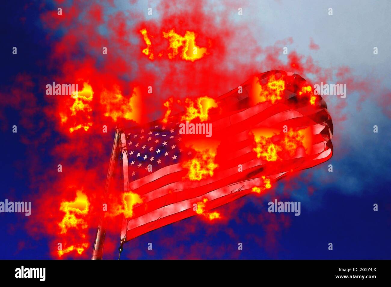 US flag goes up in flames as it hangs from a flag pole on a clear and ...