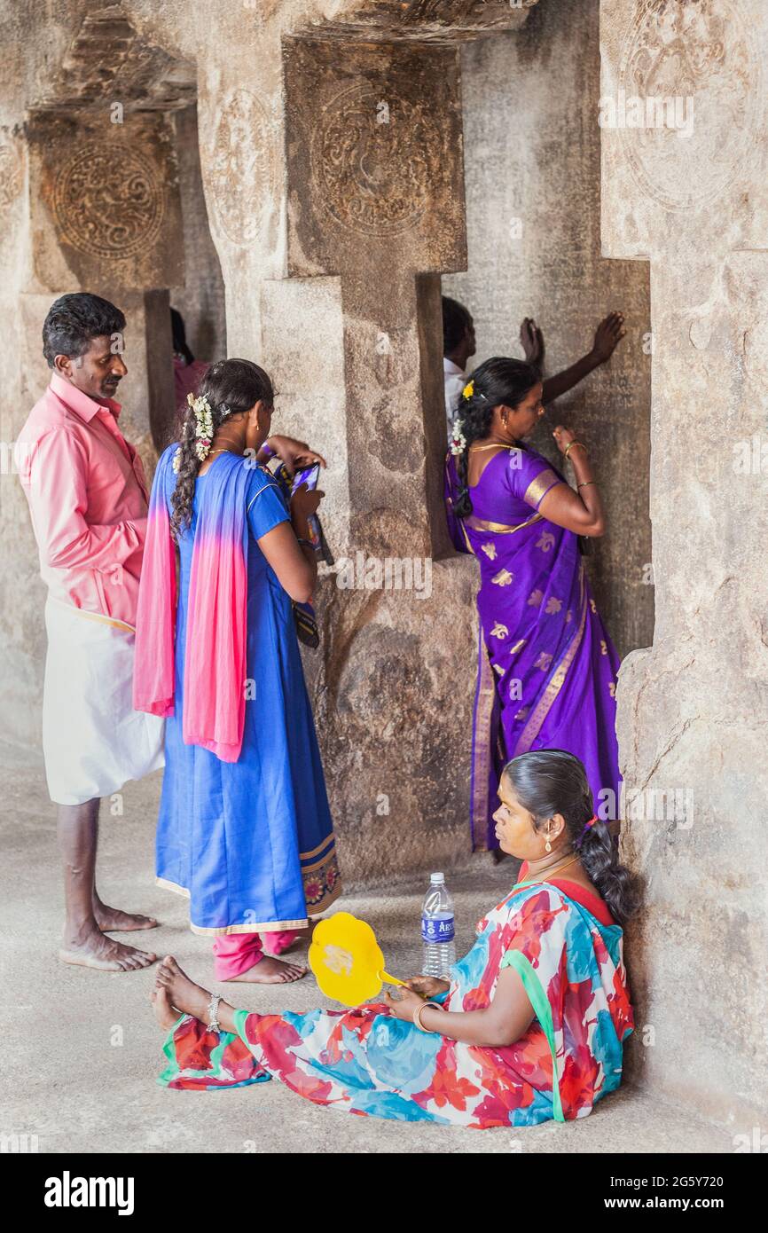 Indian families viewing the pallava grantha script engravings at the ...
