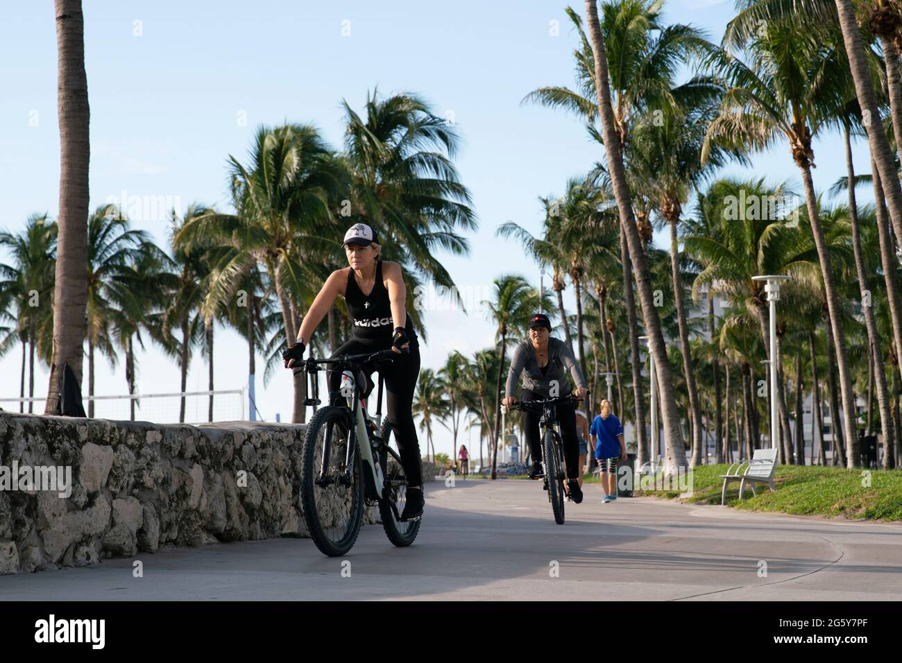 People exercising on the pathway running along the edge of South Beach ...