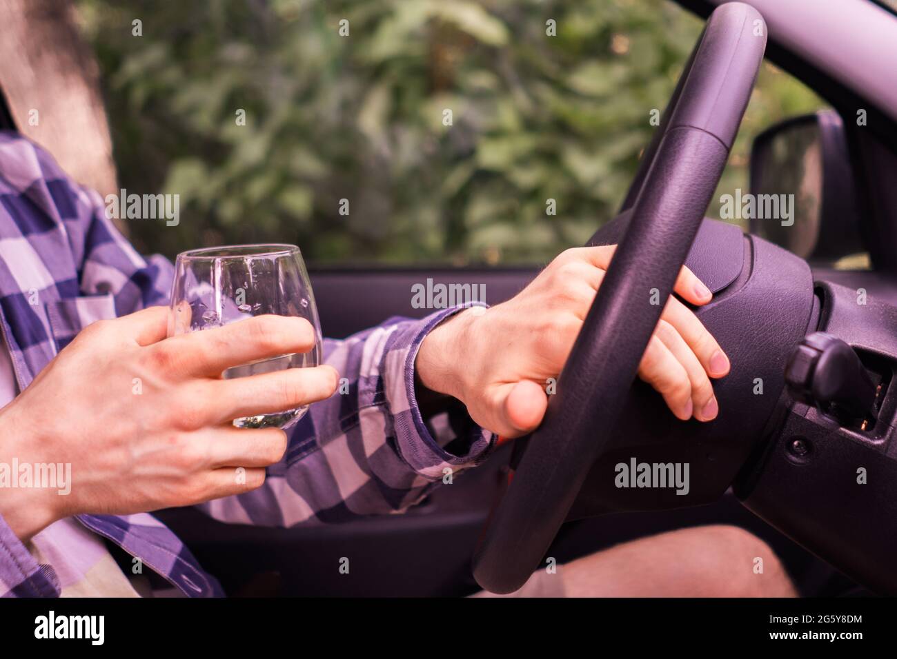 young crazy drunk man driving the car and drinking alcohol Stock Photo ...