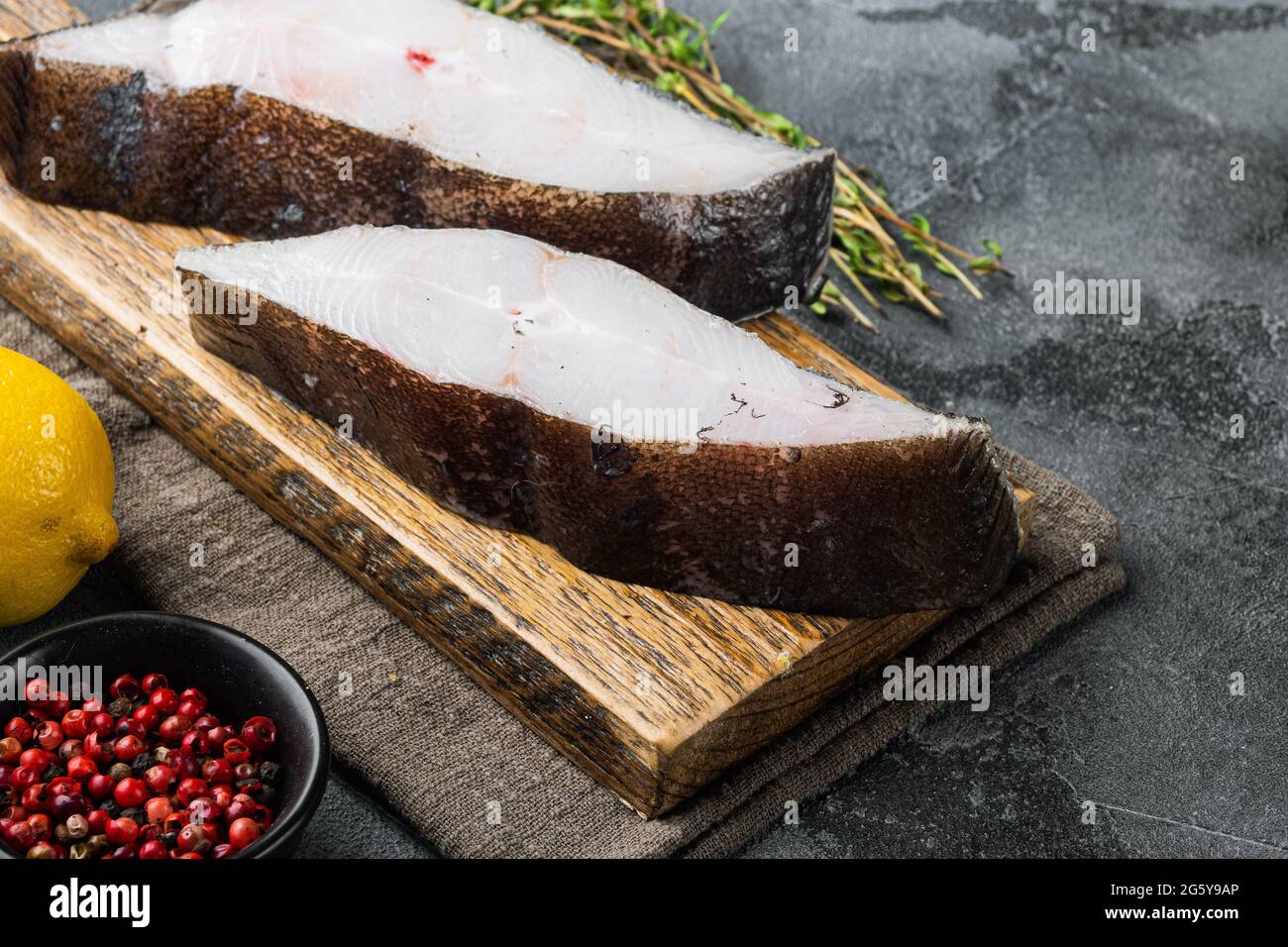 Fresh steak raw fish halibut set, with ingredients and rosemary herbs ...