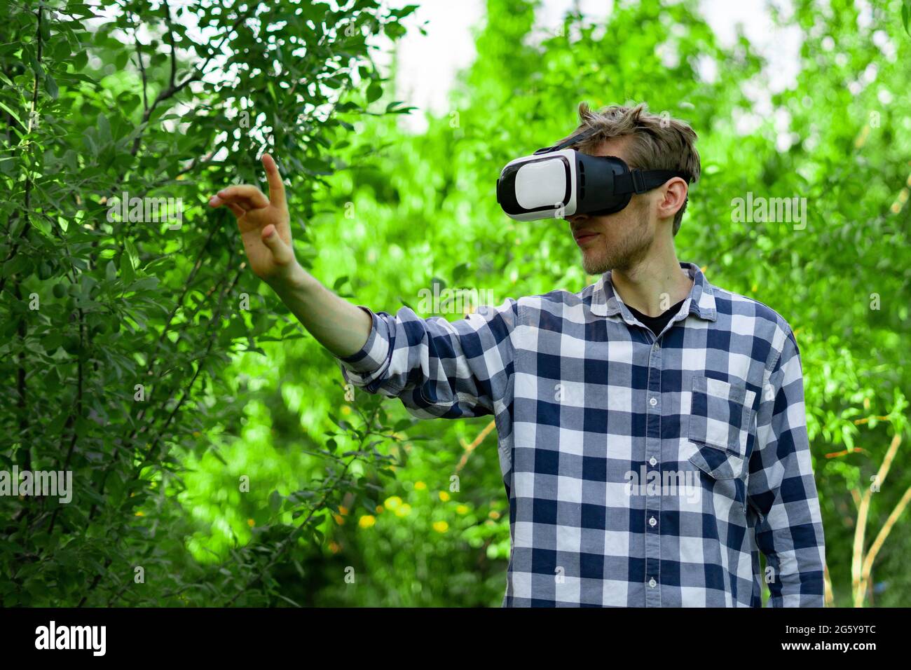 farmer using his cr glasses to plant some trees, future agriculture ...