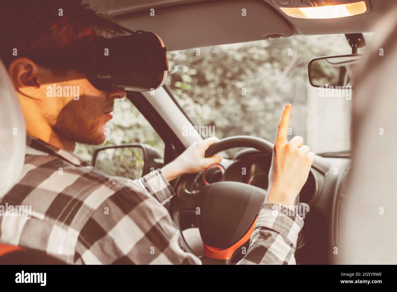 driver using vr glasses in his car,future driving concept Stock Photo ...