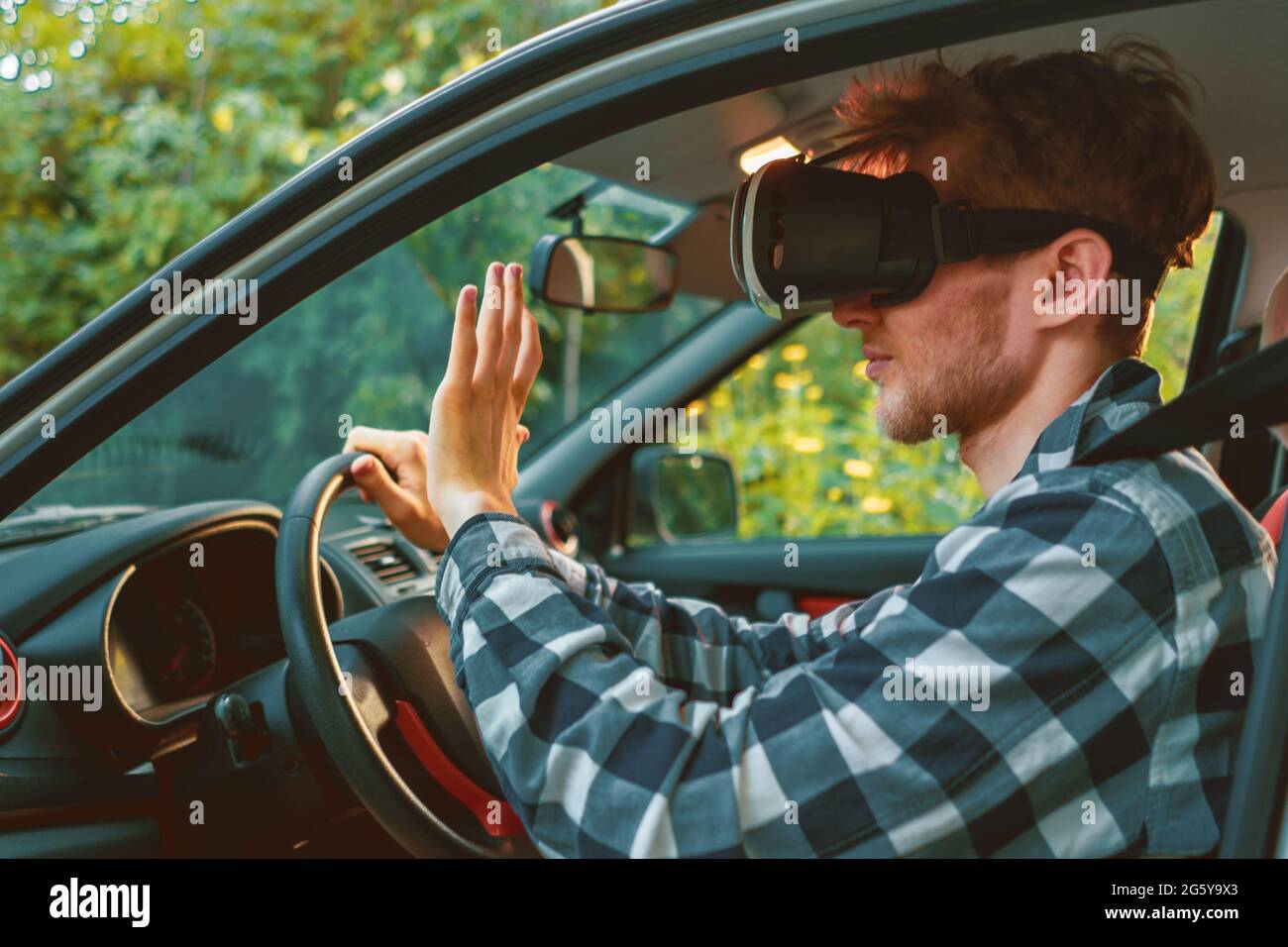 driver using vr glasses in his car,future driving concept Stock Photo ...