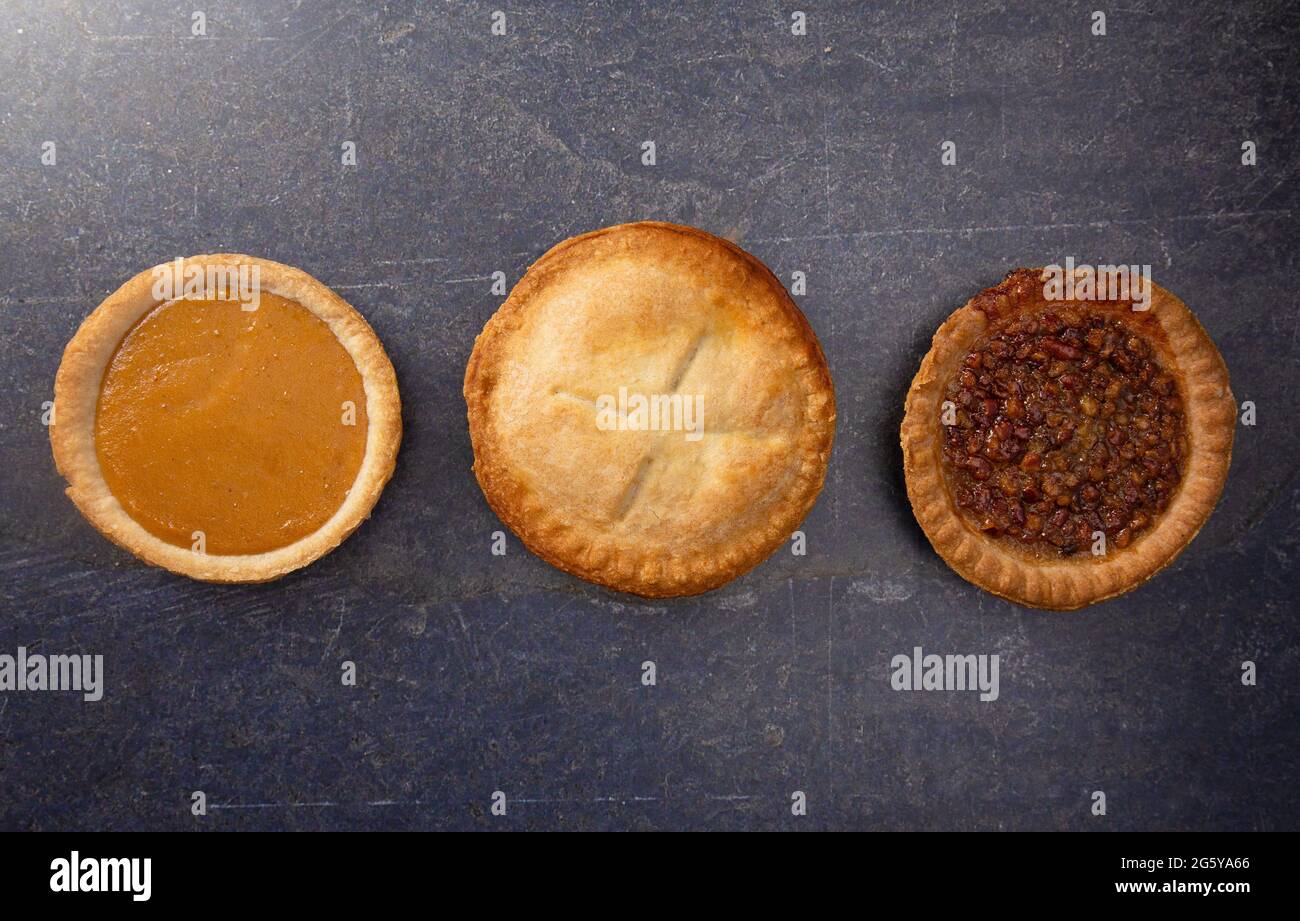 A Holiday Table Set with Various Flavors of Fresh Baked Pies Stock ...