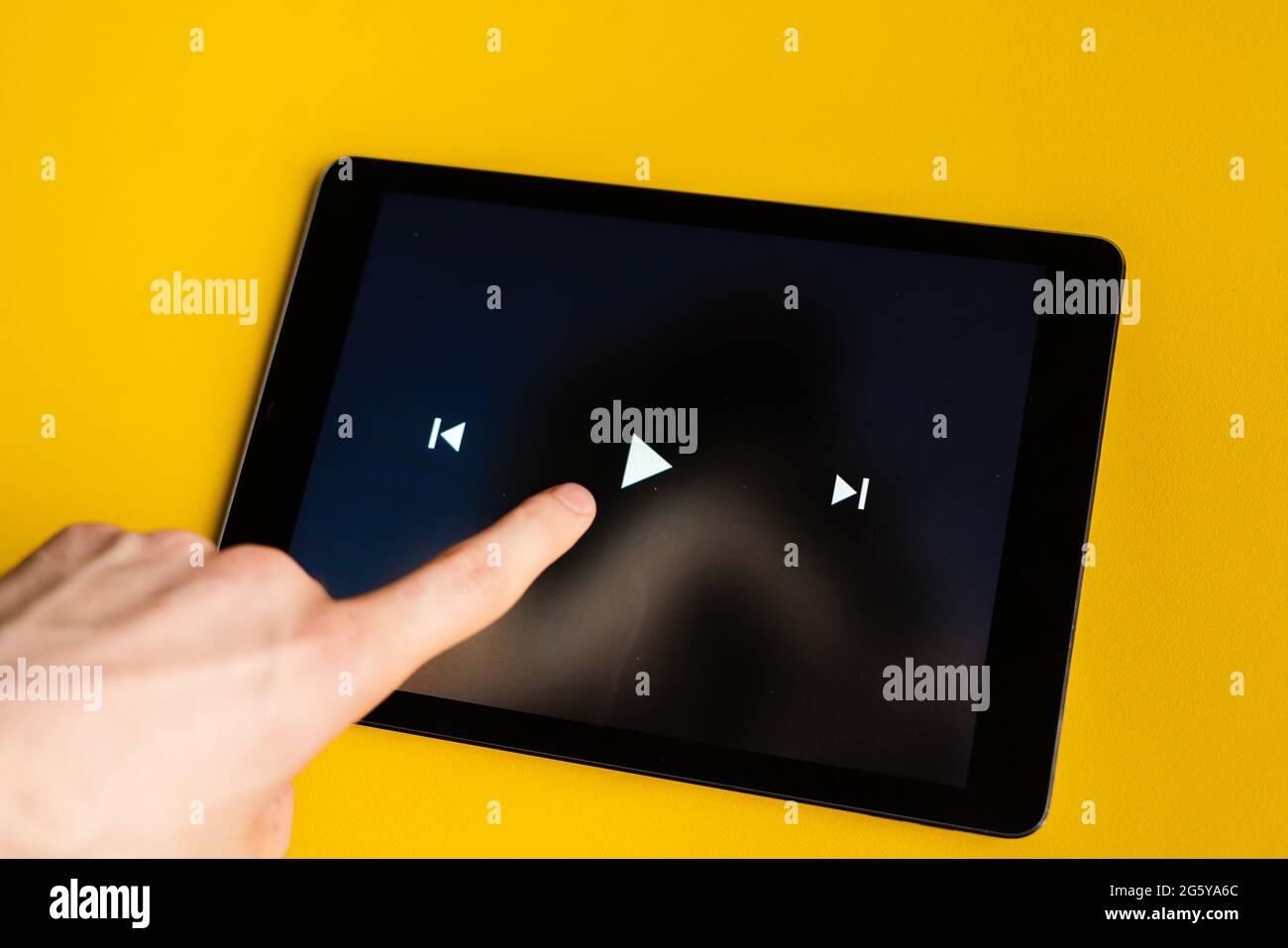 close up play button interface on a modern gadget when watching video ...