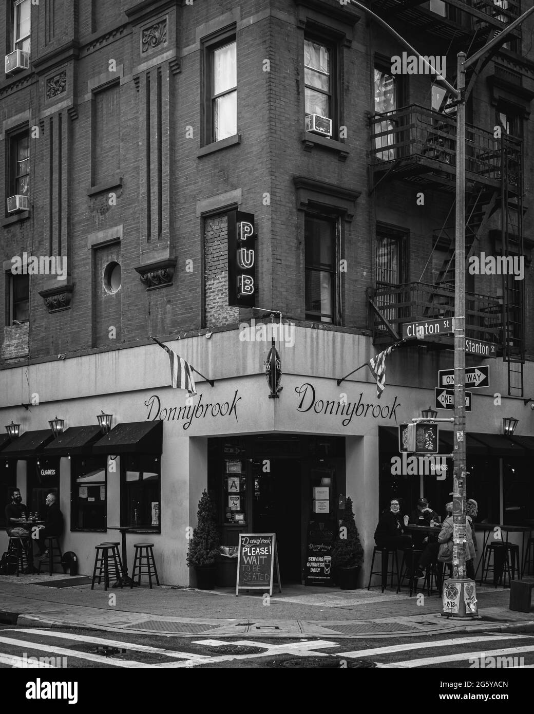Pub neon sign and street corner in the Lower East Side, Manhattan, New ...