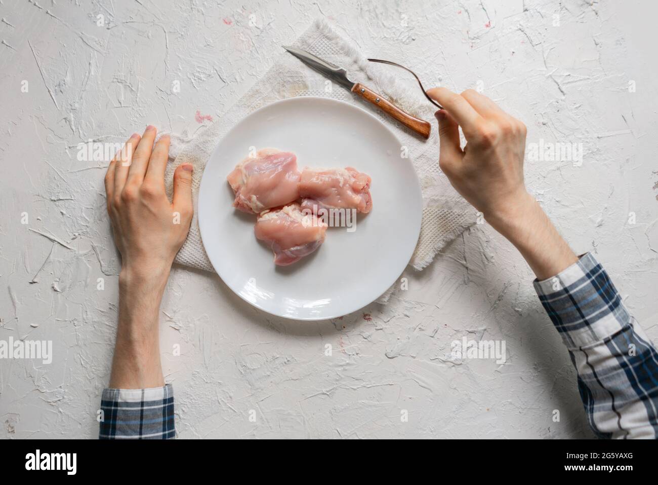 top view of person hands eat raw uncooked meat in the plate Stock Photo ...