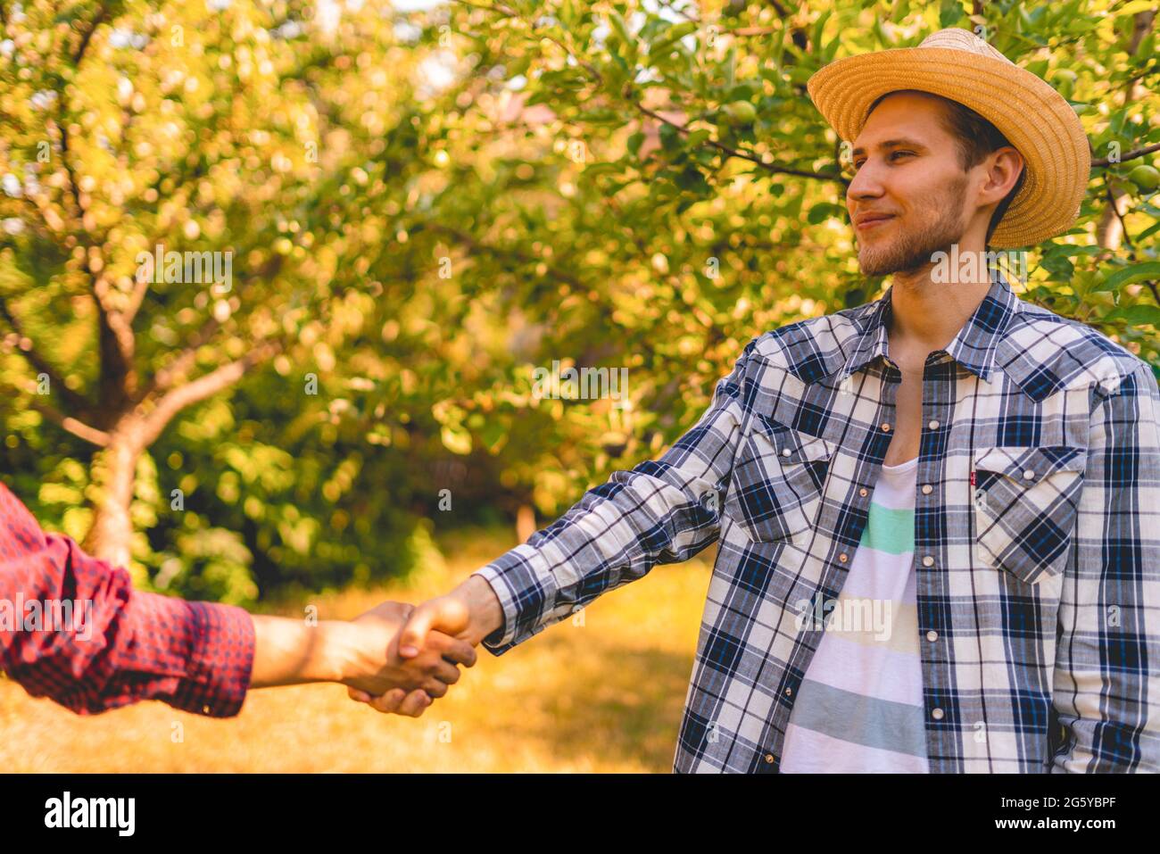Farmer businessman shaking hands hi-res stock photography and images ...