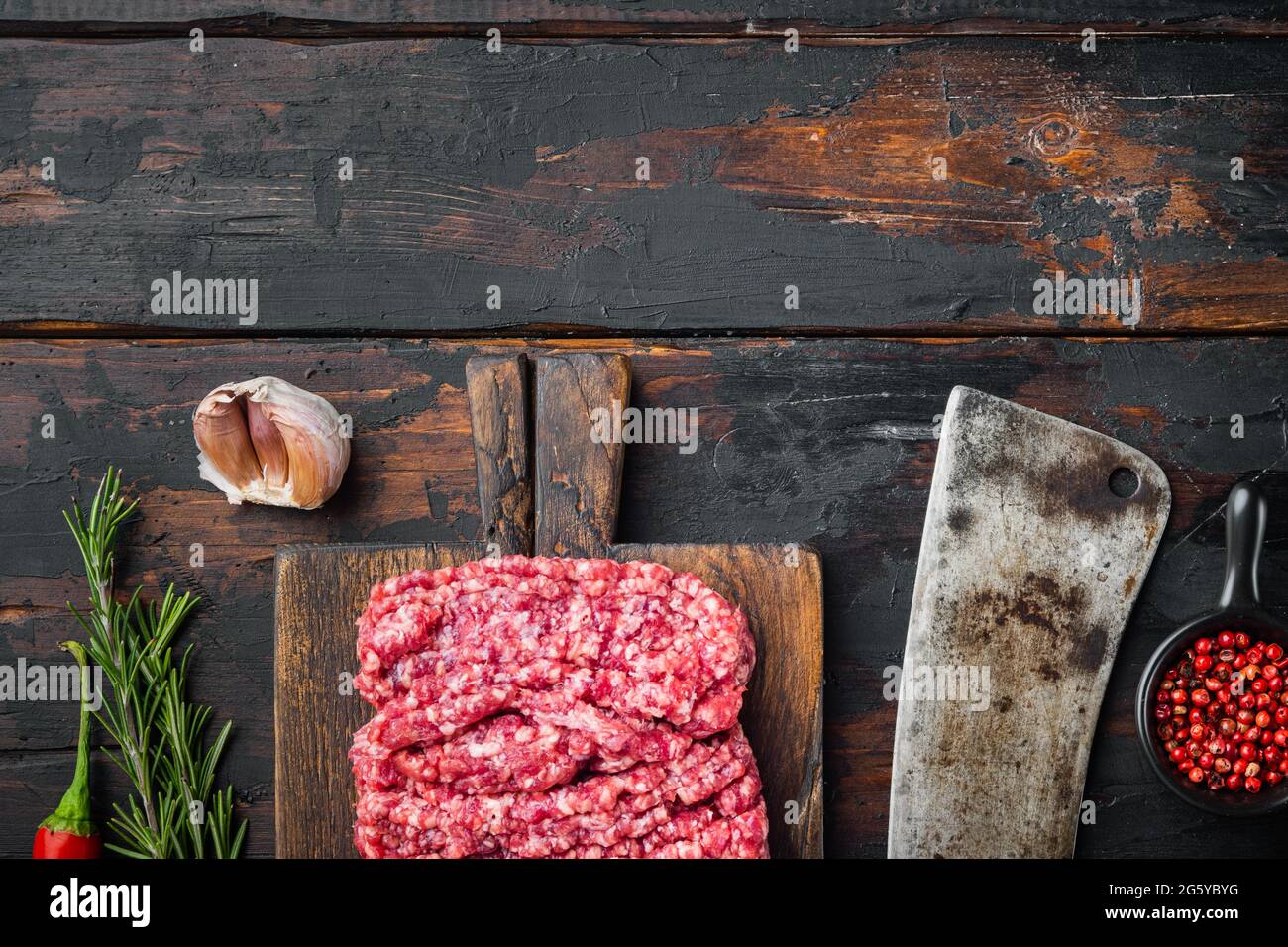 Fresh Raw mince, Minced beef, ground meat, on old dark wooden table ...