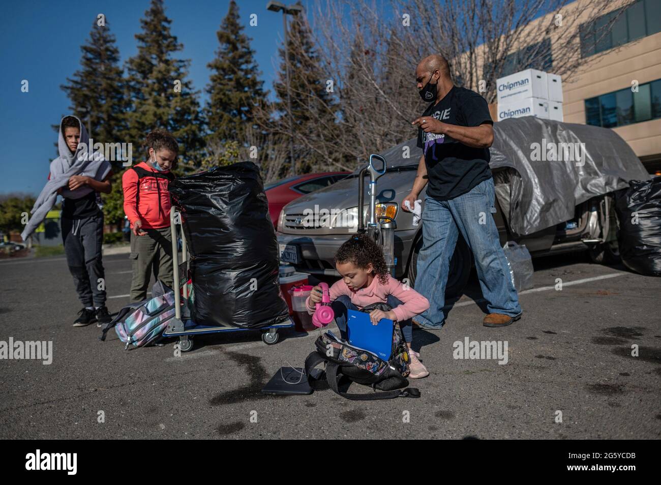 Shyann Slain, 7, puts away her computer and school supplies on Saturday ...