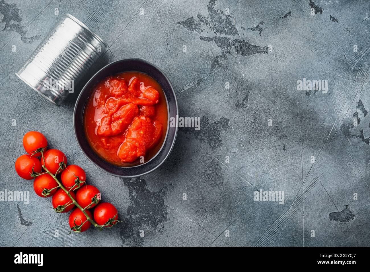 Whole canned tomatoes, on gray background, top view flat lay with copy ...