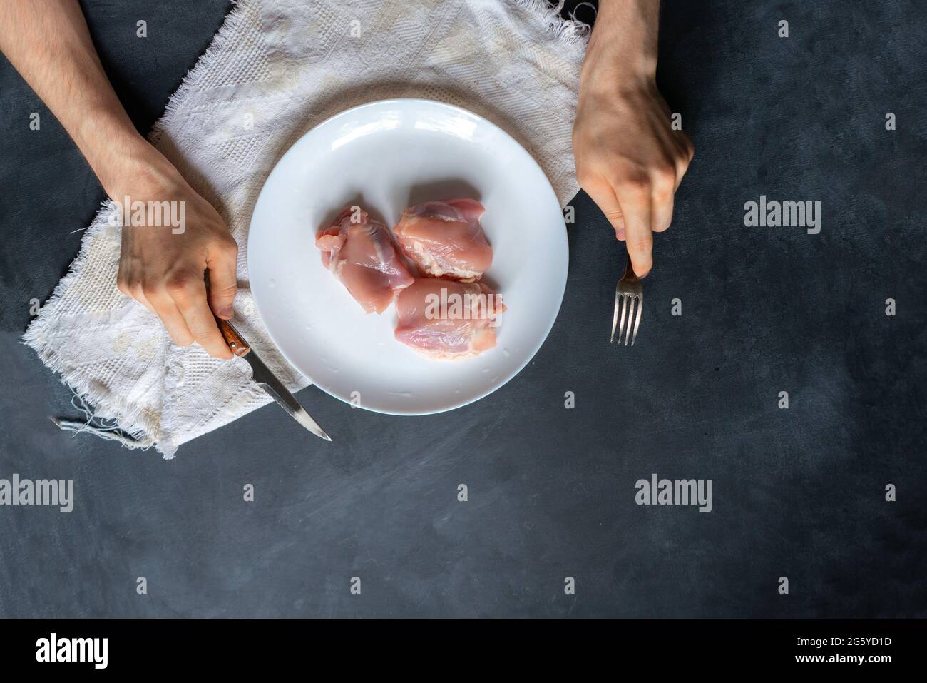 top view of person hands eat raw uncooked meat in the plate Stock Photo ...