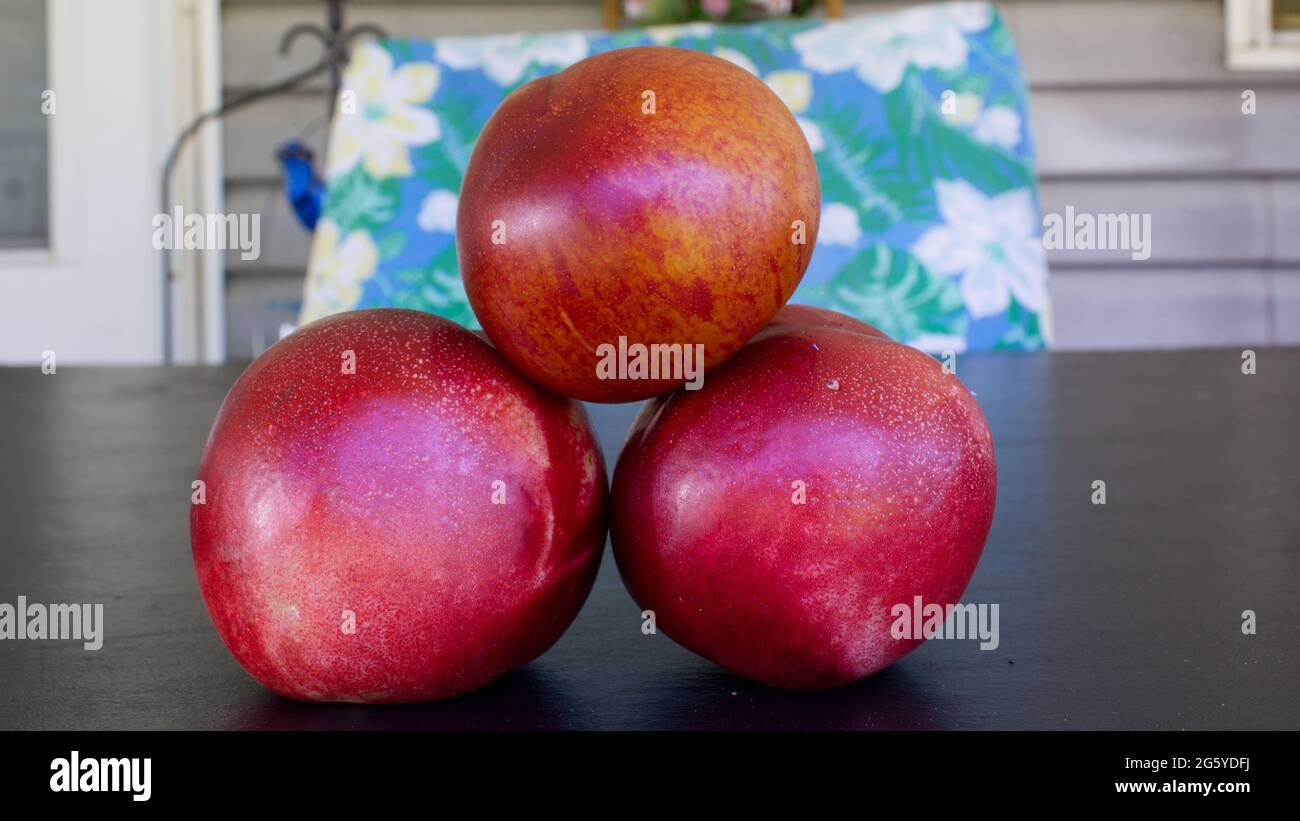 Three Nectarines in a Pyramid Shape Stock Photo - Alamy