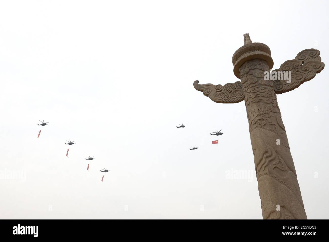 Beijing, China. 1st July, 2021. Helicopters fly over Tian'anmen Square ...