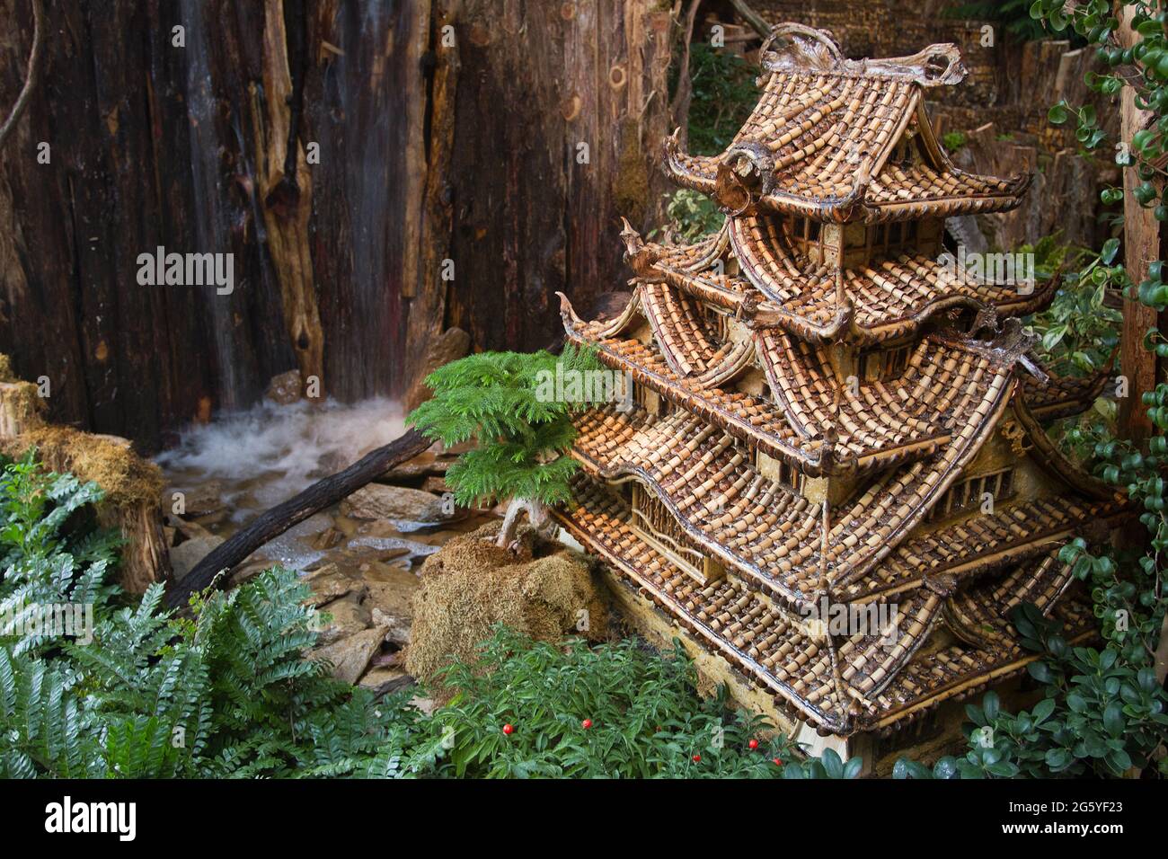 A scaled-down model of an Asian pagoda sits on display Stock Photo - Alamy
