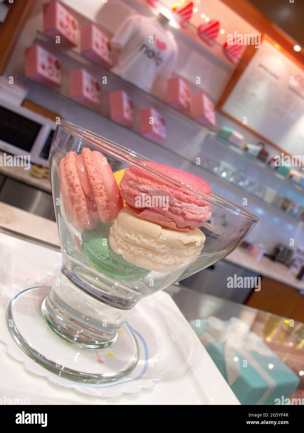 Colorful macaroons are displayed in a glass bowl Stock Photo - Alamy