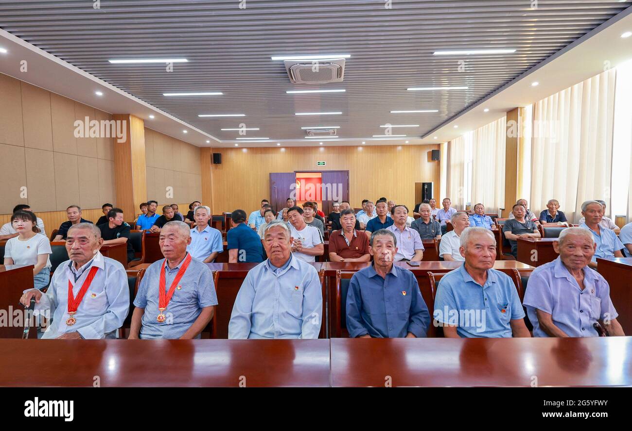 SUQIAN, CHINA - JULY 1, 2021 - Party members watch a celebration ...