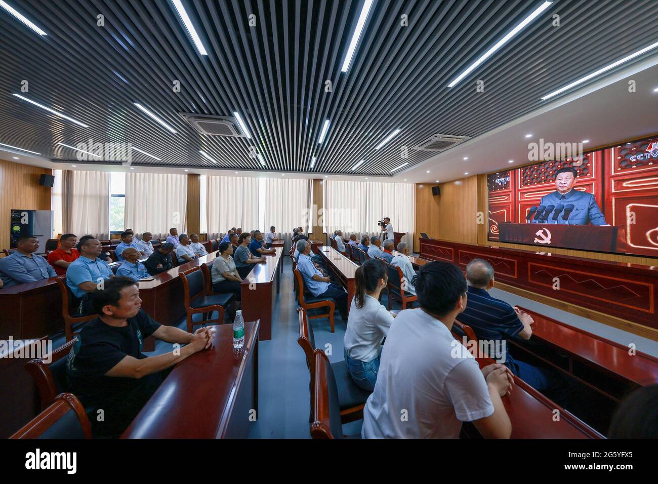 SUQIAN, CHINA - JULY 1, 2021 - Party members watch a celebration ...