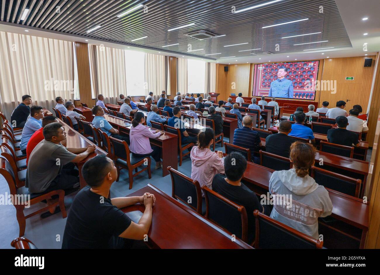 SUQIAN, CHINA - JULY 1, 2021 - Party members watch a celebration ...