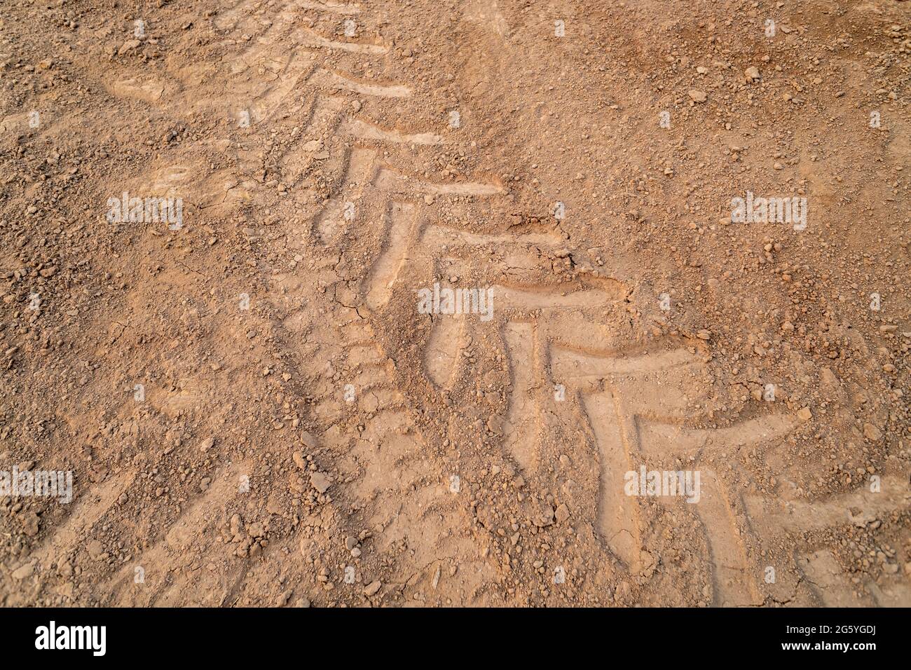 Wheel tracks on the ground Stock Photo - Alamy