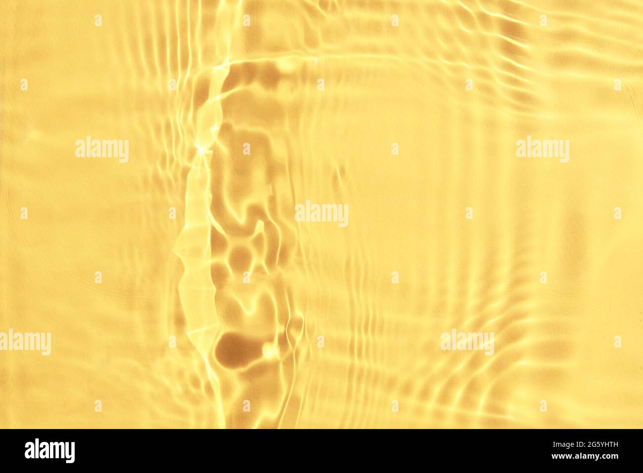 Yellow water surface background. Water texture with reflections ...