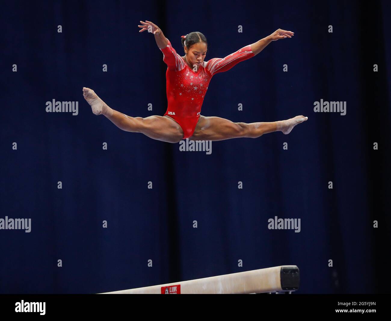 June 25, 2021: Shilese Jones leaps into the air on the balance beam ...
