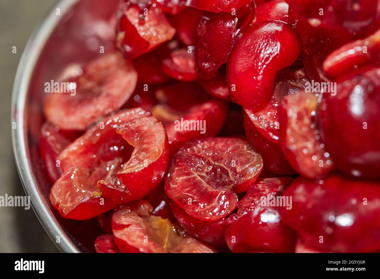 Pitted cherries are ready in pie bowl. Step by step recipe Stock Photo ...