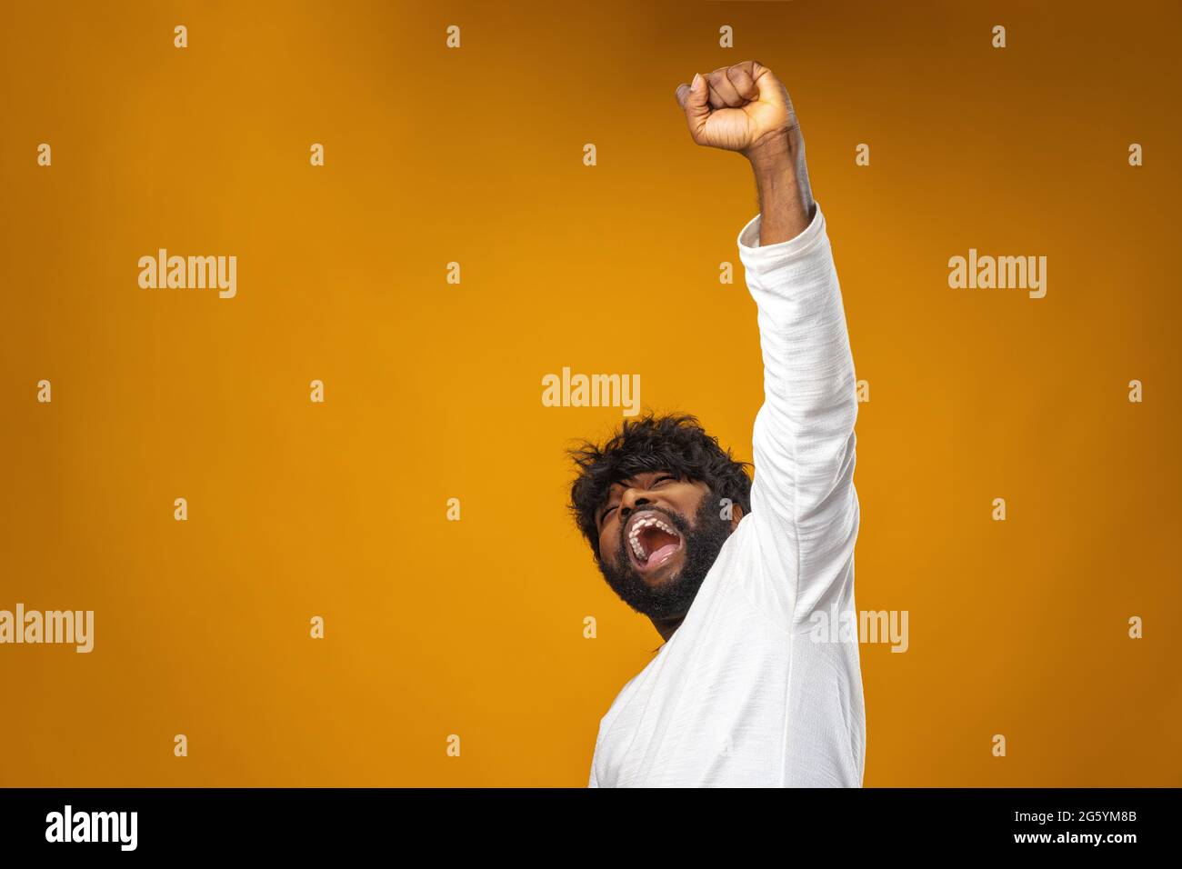 Portrait of overjoyed black man celebrating success Stock Photo - Alamy