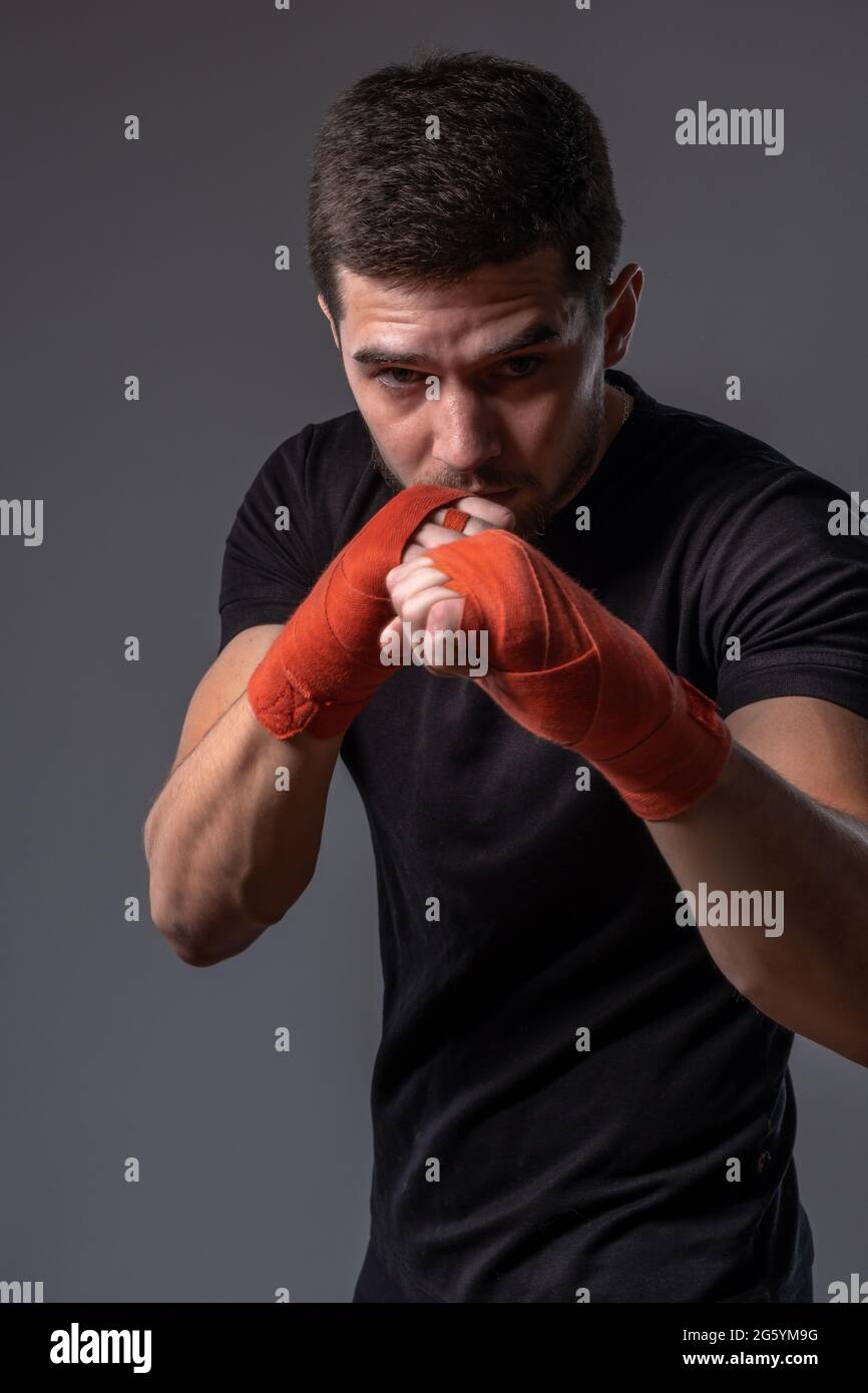 Sporty man with hands wraps standing in orthodox fighting stance Stock ...