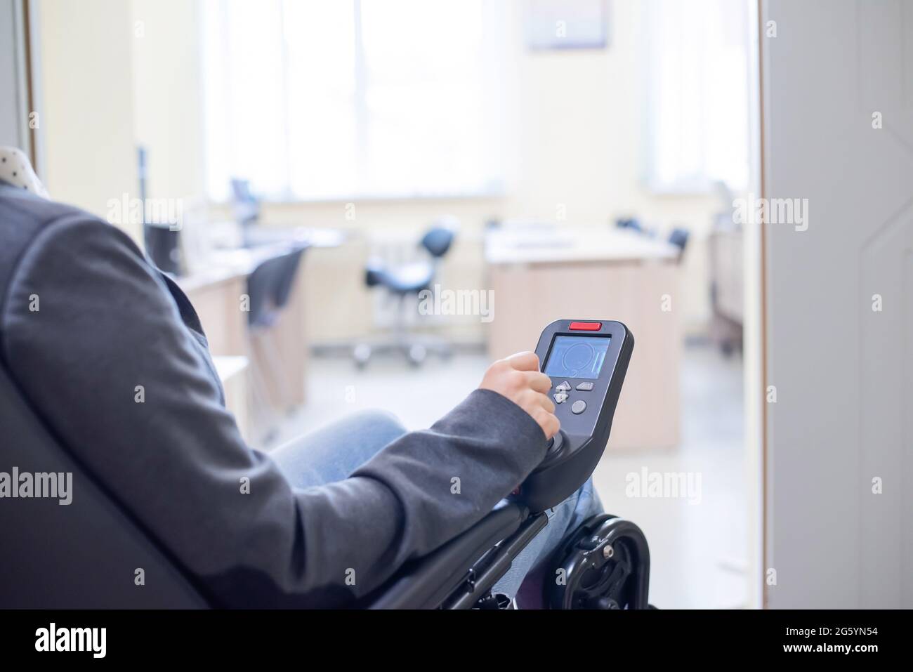 Close-up of a female hand on the control handle of an electric ...