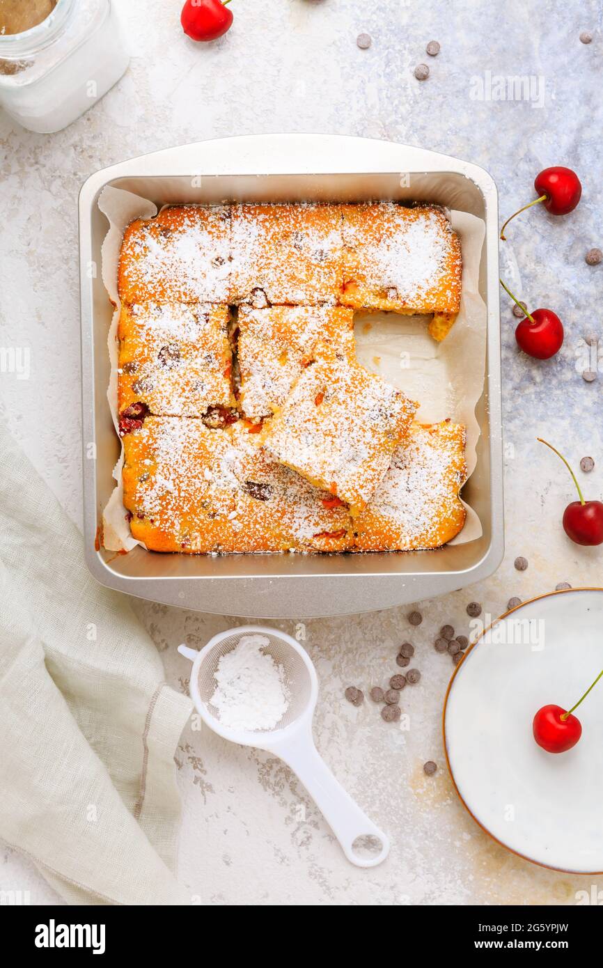 Homemade cherry sponge cake with chocolate drops with ingredients Stock ...