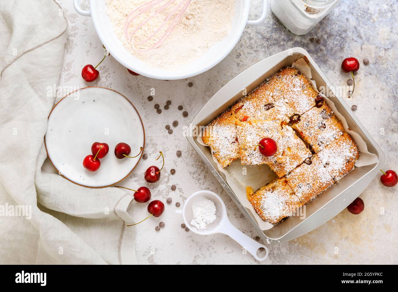 Homemade cherry sponge cake with chocolate drops with ingredients Stock ...