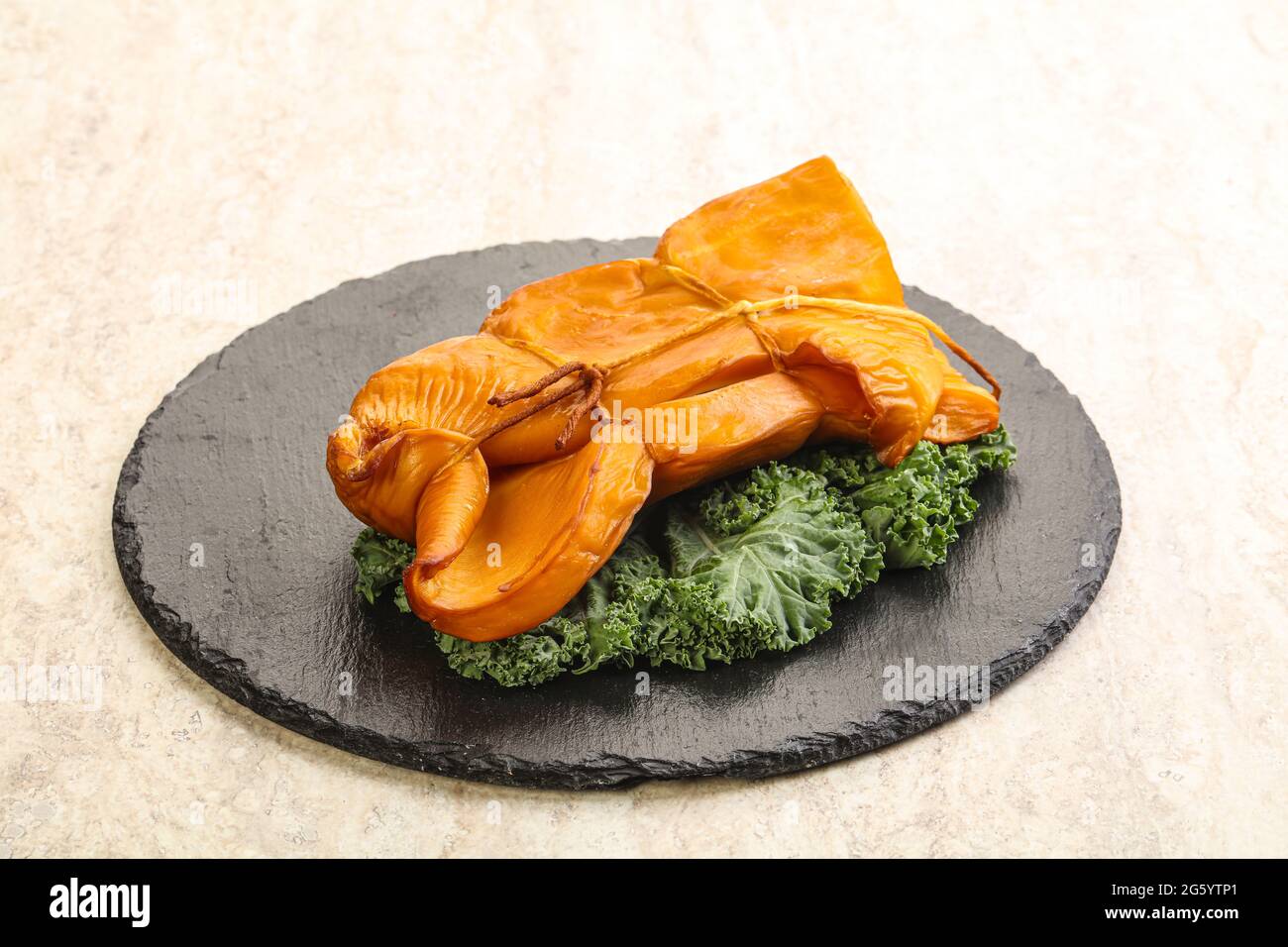 Smoked squid calamar appetizer snack isolated Stock Photo - Alamy