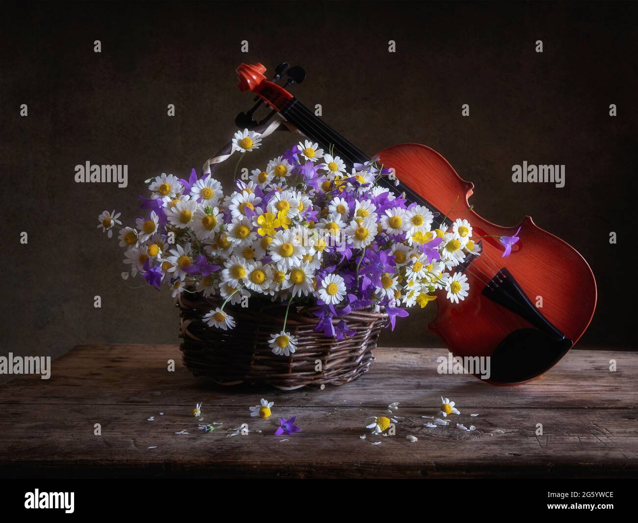 Still life with bouquet of wildflowers and violin Stock Photo - Alamy